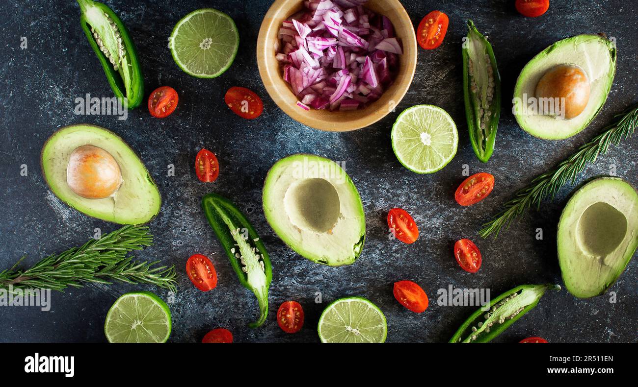 Avocado, red onions, tomatoes, rosemary and lime Stock Photo - Alamy