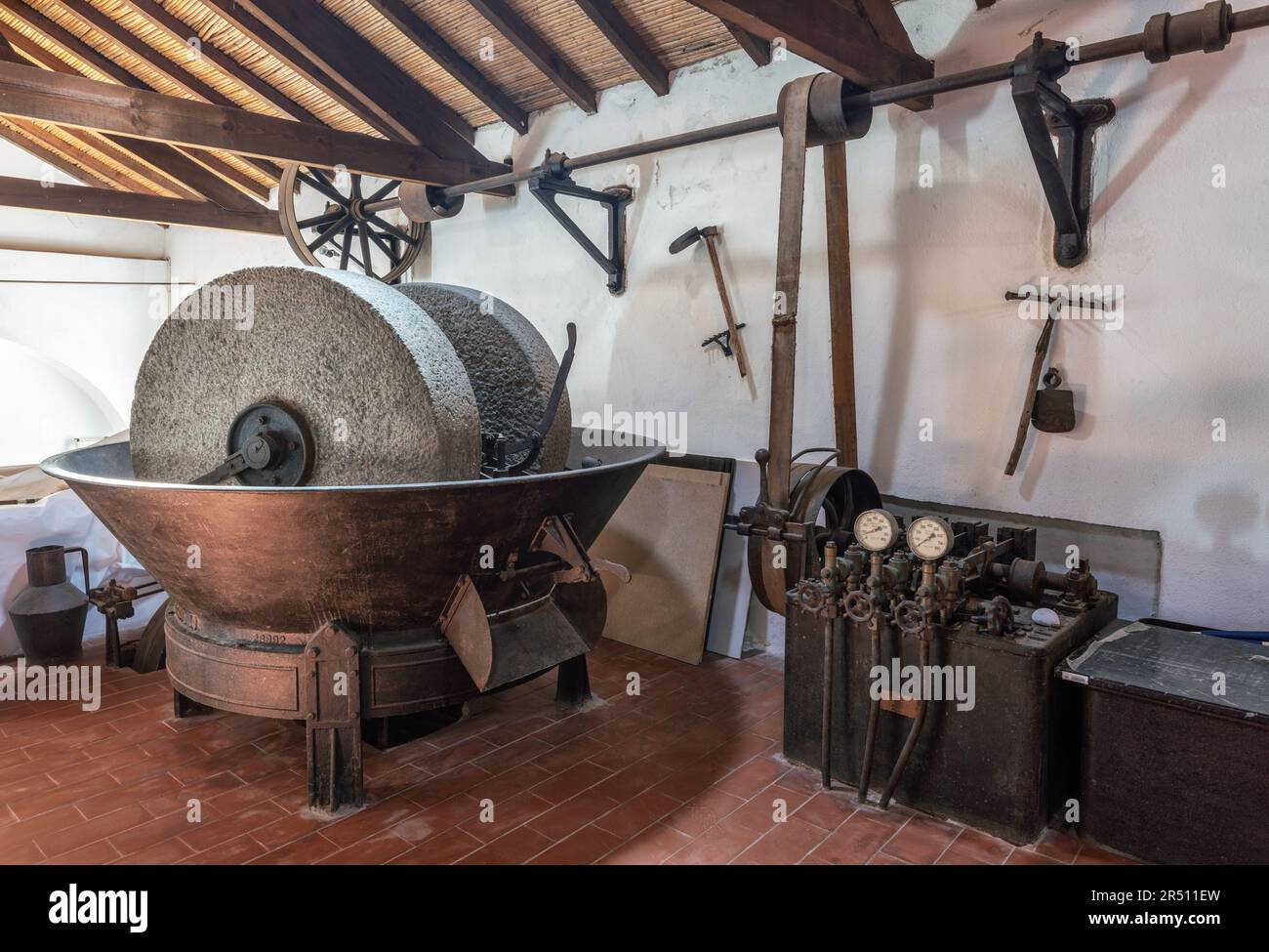 Olive oil press is installed in premises of the ancient equipment for ...