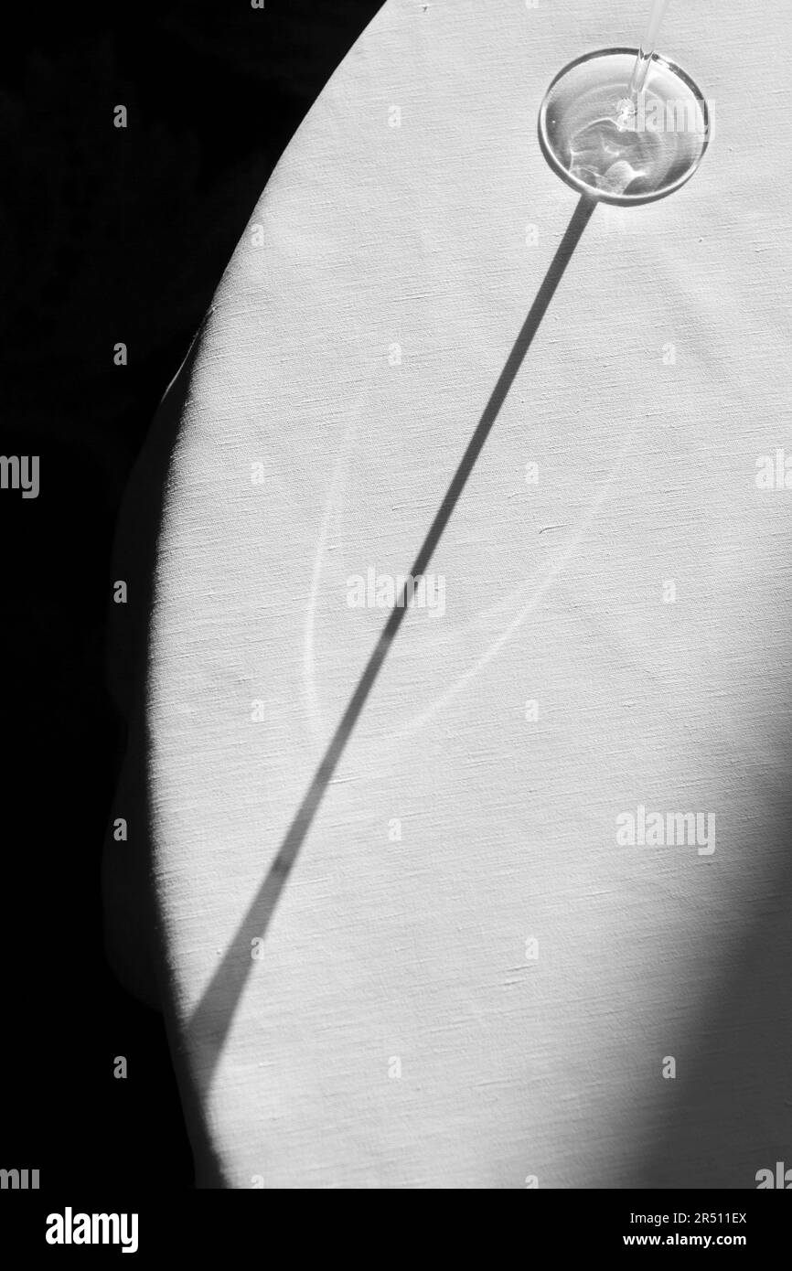 Shadow from the stem of a champagne glass Stock Photo - Alamy