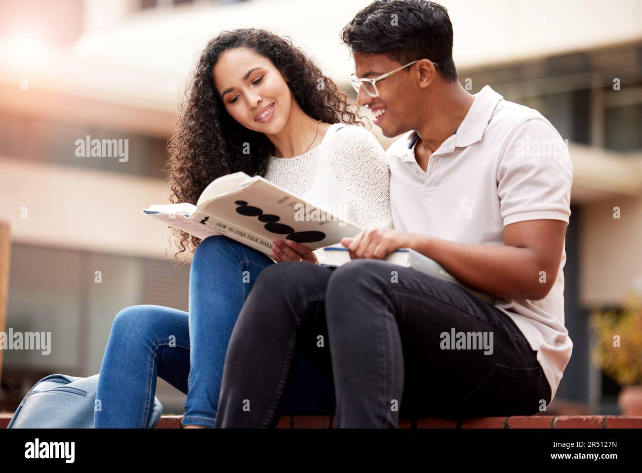 Study, university and man and woman with book on campus for learning ...