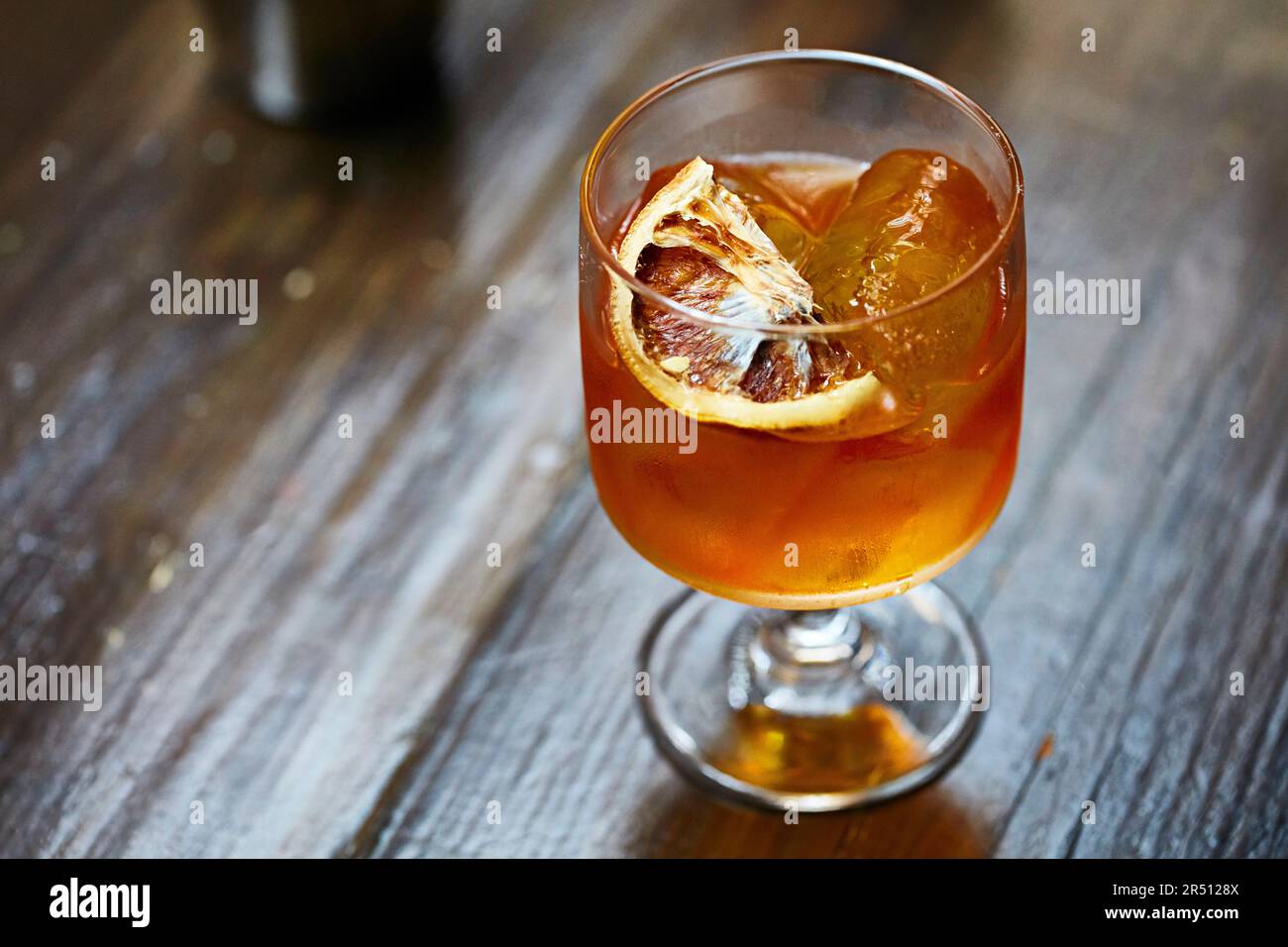 Blood orange cocktail with gin and ice cubes Stock Photo - Alamy