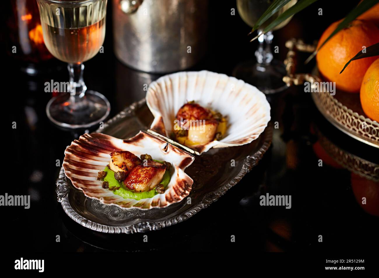 Scallops served in their shells Stock Photo - Alamy