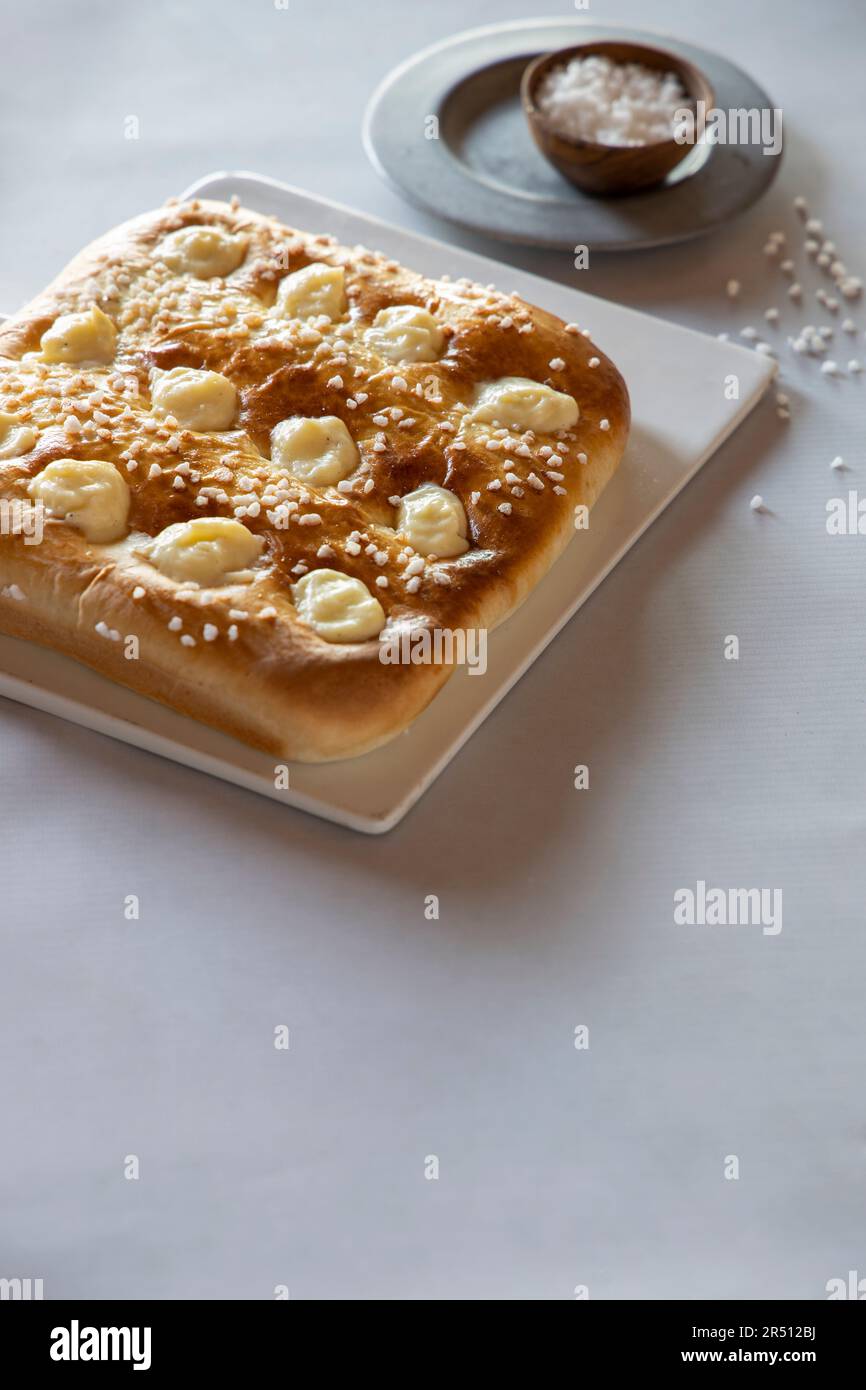 Sweet focaccia filled with vanilla cream Stock Photo - Alamy