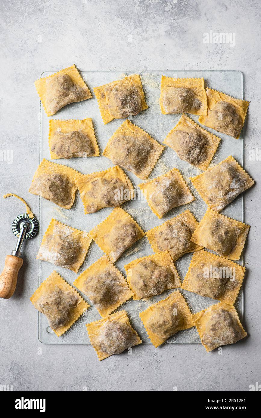 Uncooked ravioli with beef filling Stock Photo - Alamy