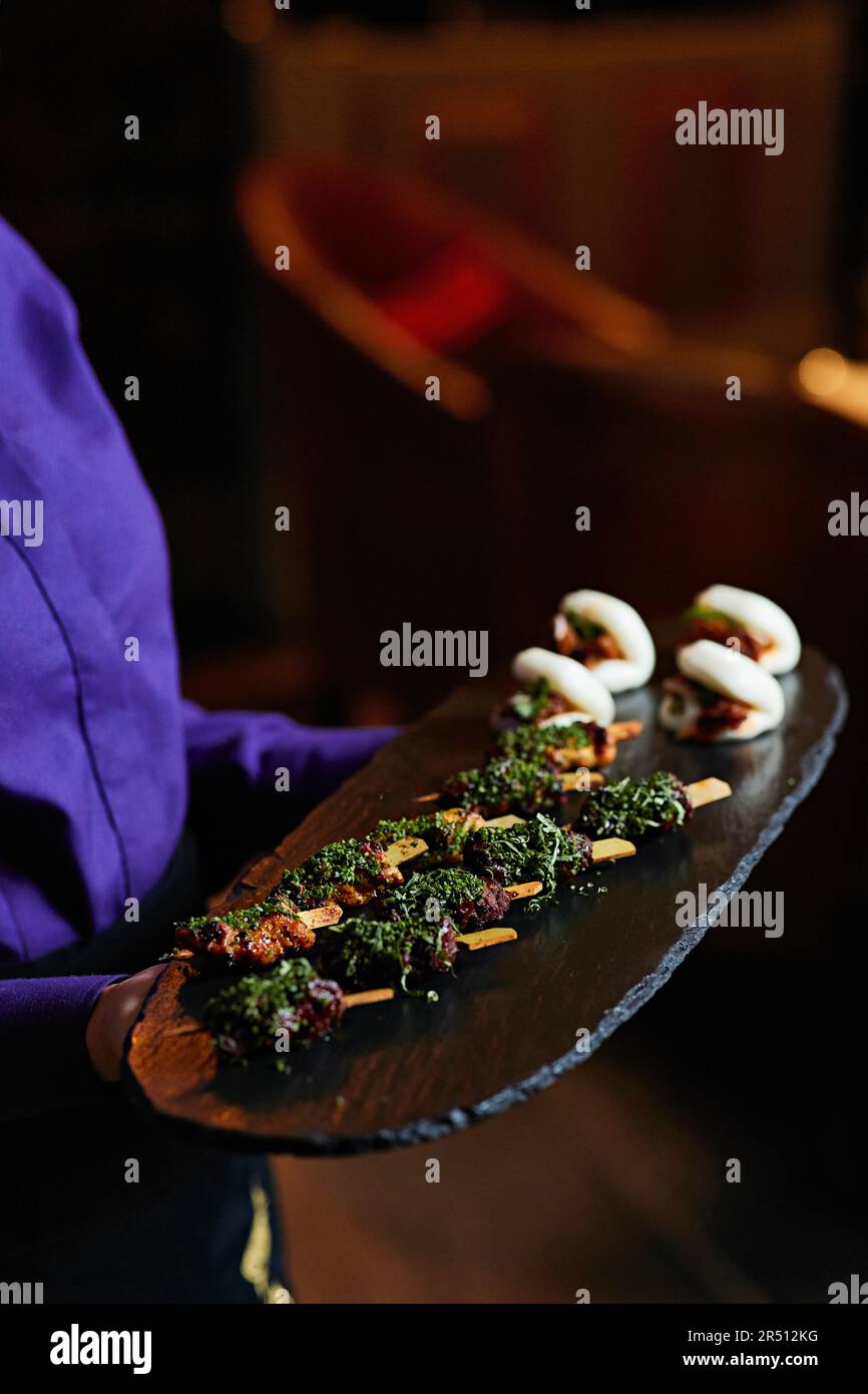 A person serving canapés Stock Photo - Alamy