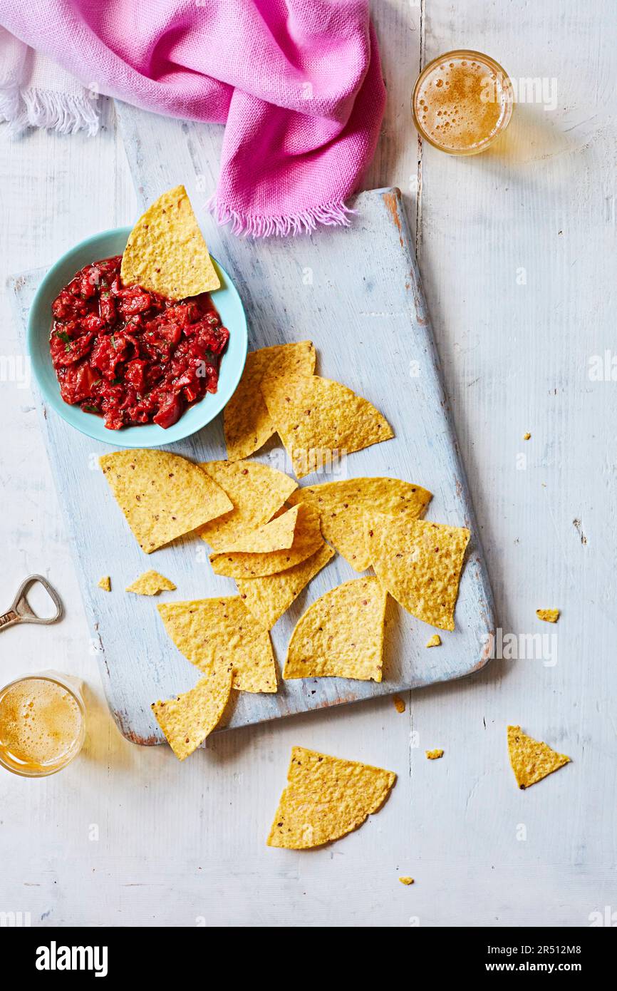 Tortilla chips with tomato salsa Stock Photo - Alamy
