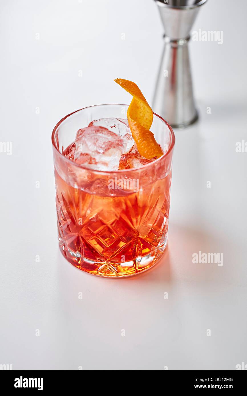 A Negroni with orange zest Stock Photo - Alamy