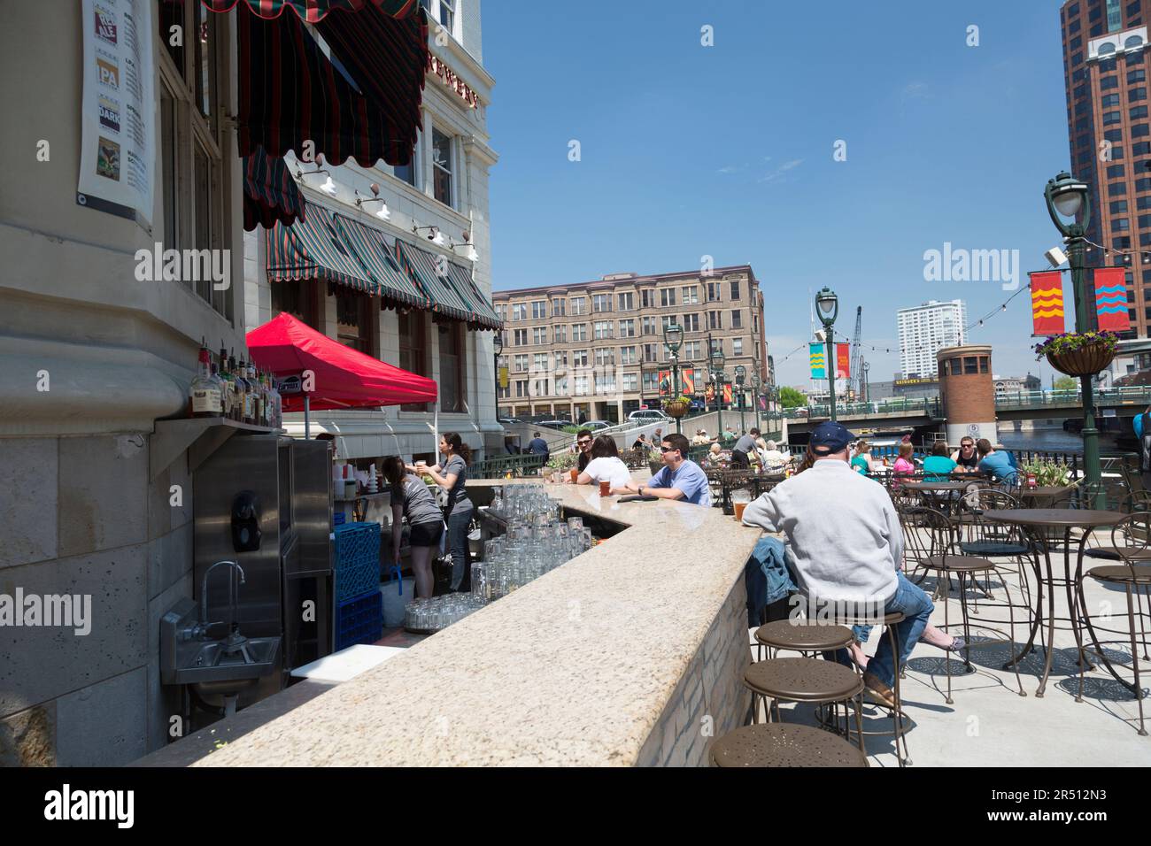 USA, Milwaukee, the riverside walkway along the Milwaukee river with ...