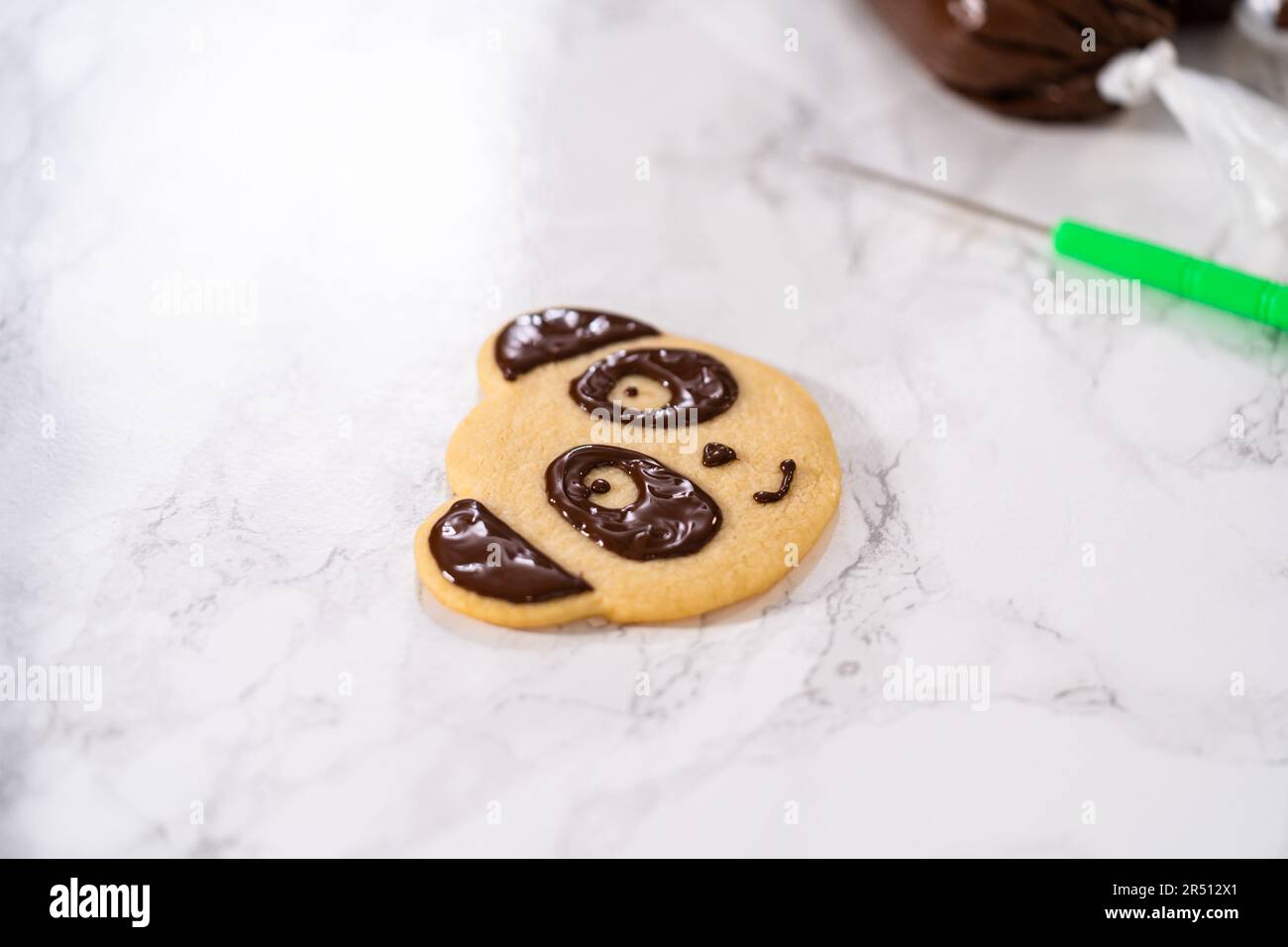 Panda shaped shortbread cookies with chocolate icing Stock Photo - Alamy