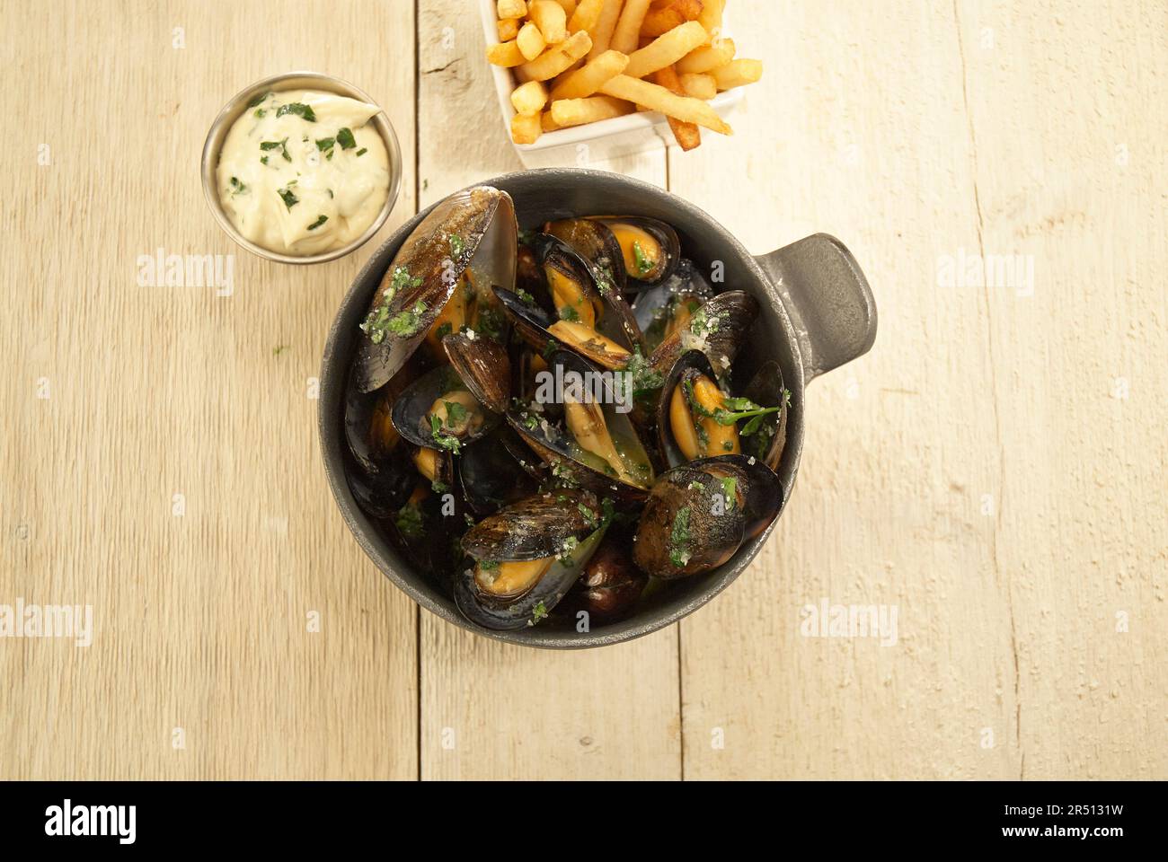 Belgian mussels with French fries and mayonnaise Stock Photo - Alamy