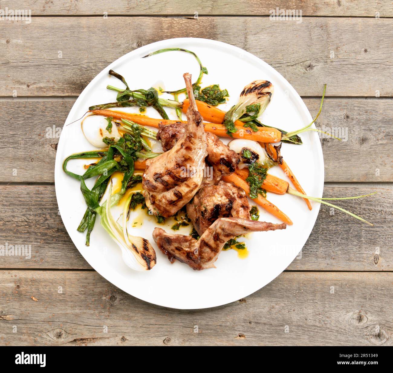 Grilled rabbit with carrots and spring onions Stock Photo - Alamy