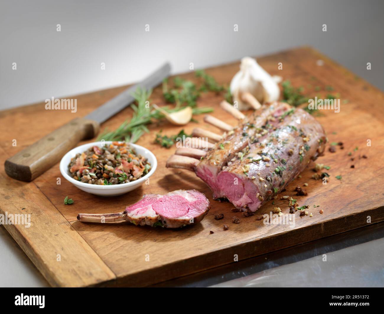 Pink roasted rack of lamb Stock Photo - Alamy