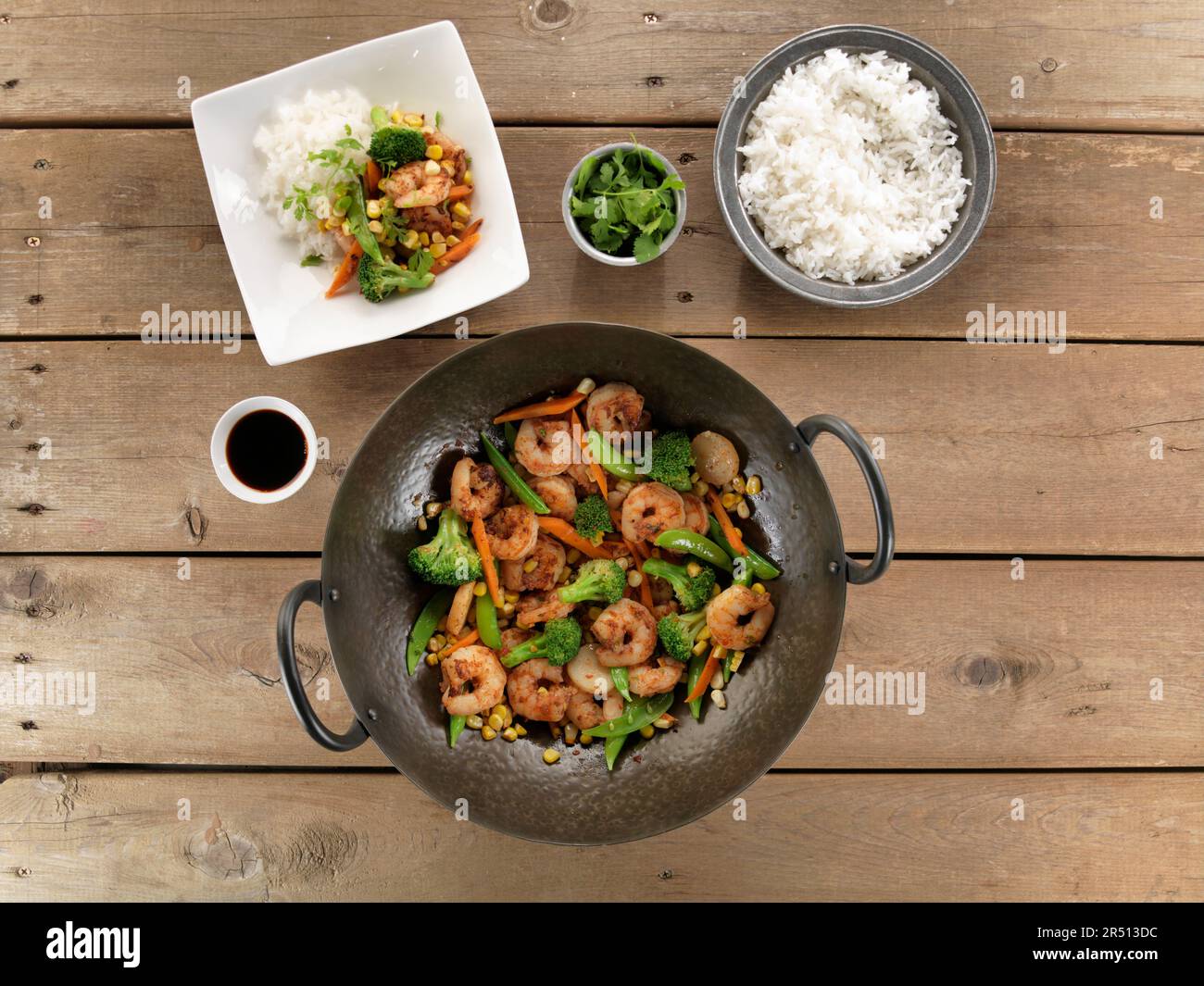 Fried prawns with vegetables in a wok served with rice Stock Photo - Alamy