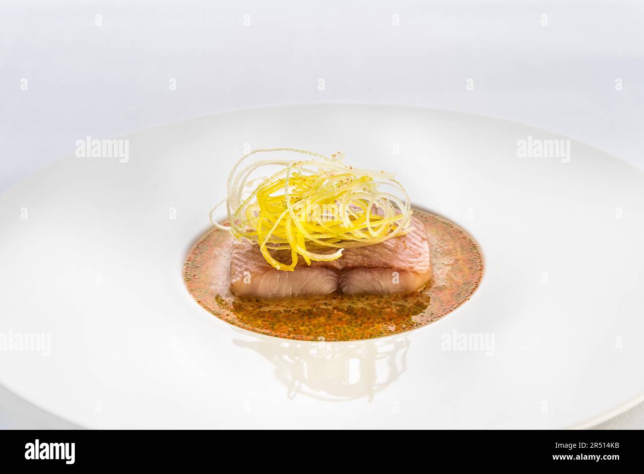 Catfish fillet served on a large white plate Stock Photo - Alamy