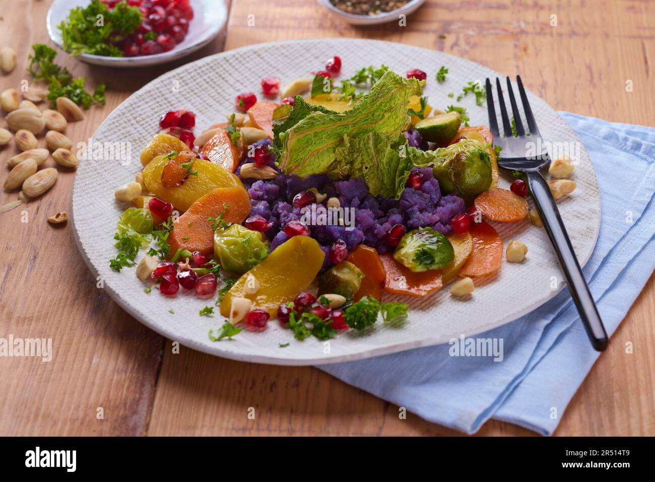 Colourful vegetable platter with pomegranate seeds and almonds Stock ...