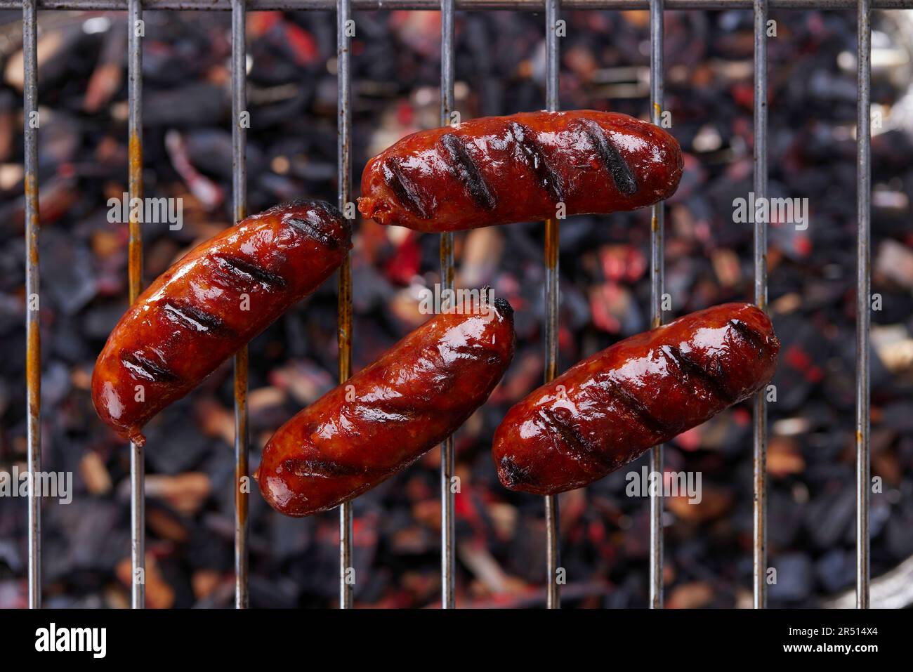 Grilled chorizo on grill rack Stock Photo - Alamy