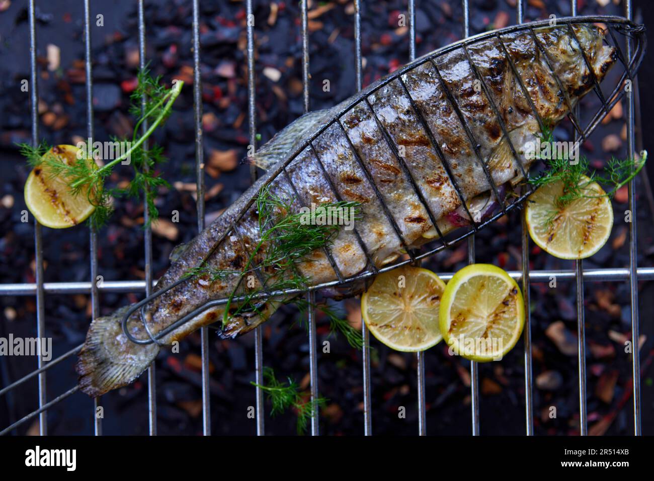 Grilled trout on grill rack Stock Photo - Alamy
