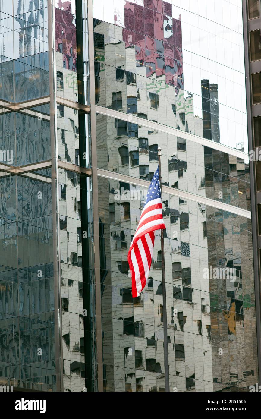 USA, Illinois, Chicago, US flag and reflections in high rise buildings ...