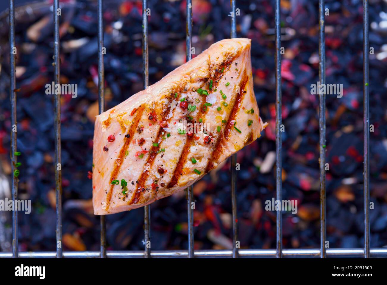 Grilled salmon fillet on grill rack Stock Photo - Alamy