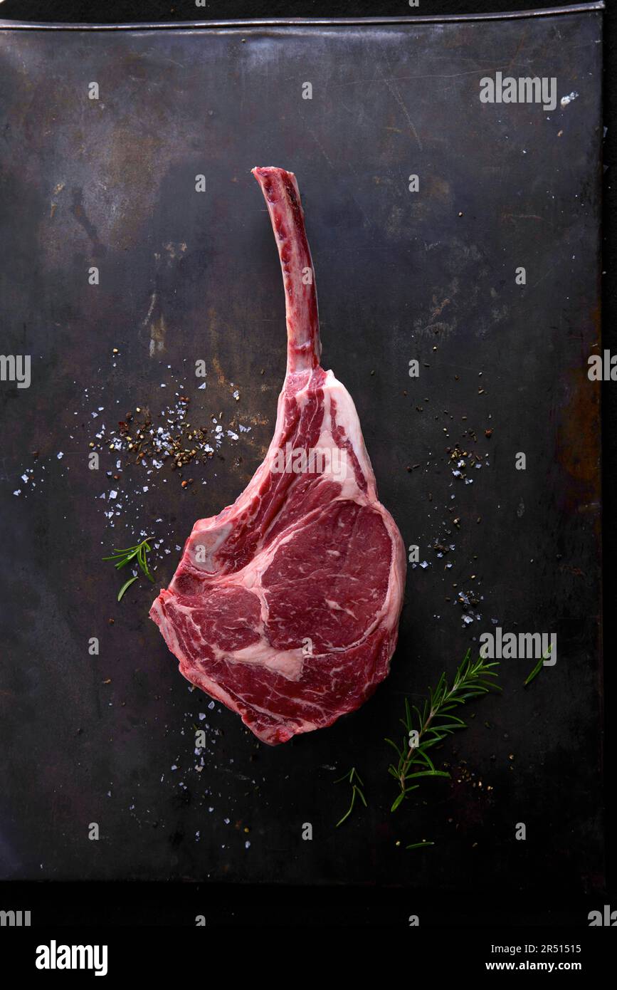 Raw tomahawk steak Stock Photo - Alamy