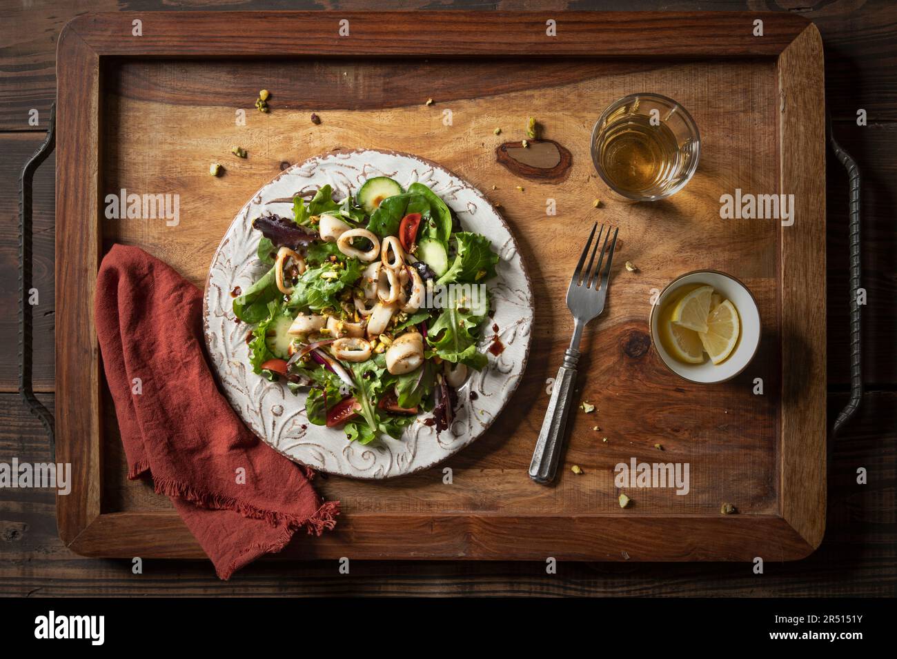 Rocket salad with grilled squid rings and cucumber Stock Photo - Alamy