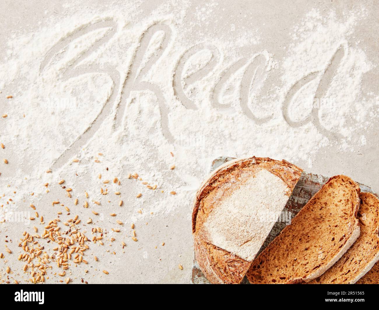 Sliced bread, grains and lettering 'Bread' in flour Stock Photo - Alamy