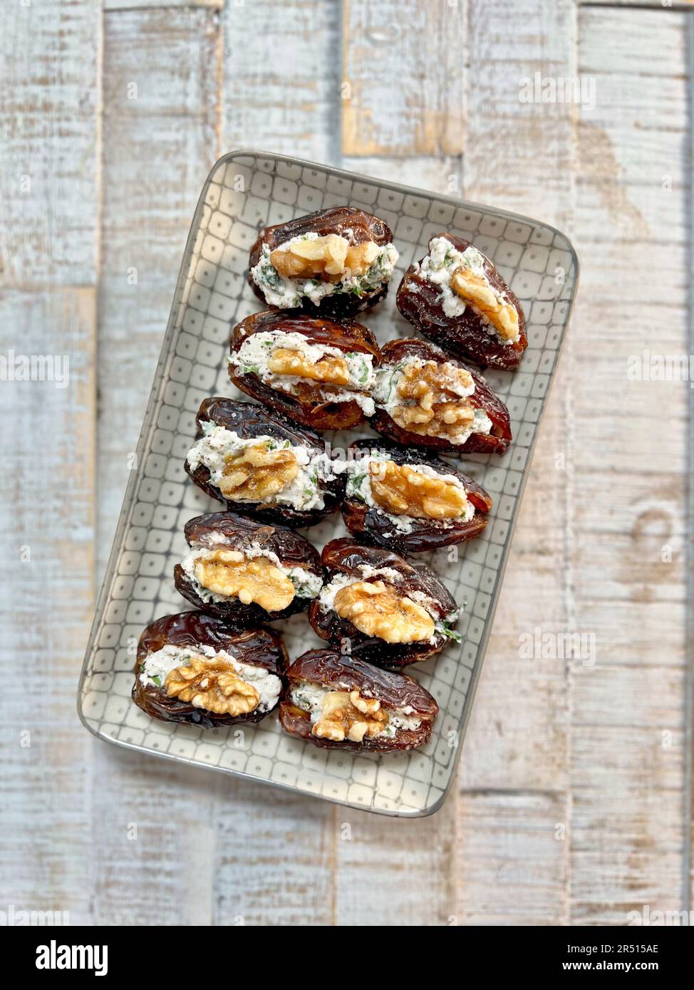 Stuffed dates with parsley cream cheese and walnuts Stock Photo - Alamy