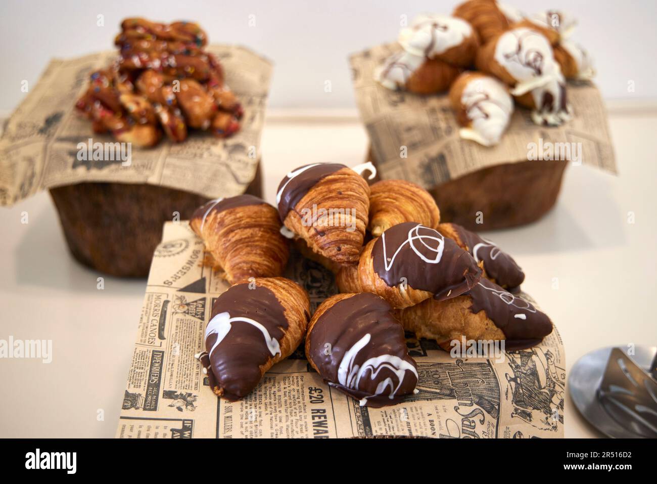 Chocolate croissants on newspaper Stock Photo - Alamy