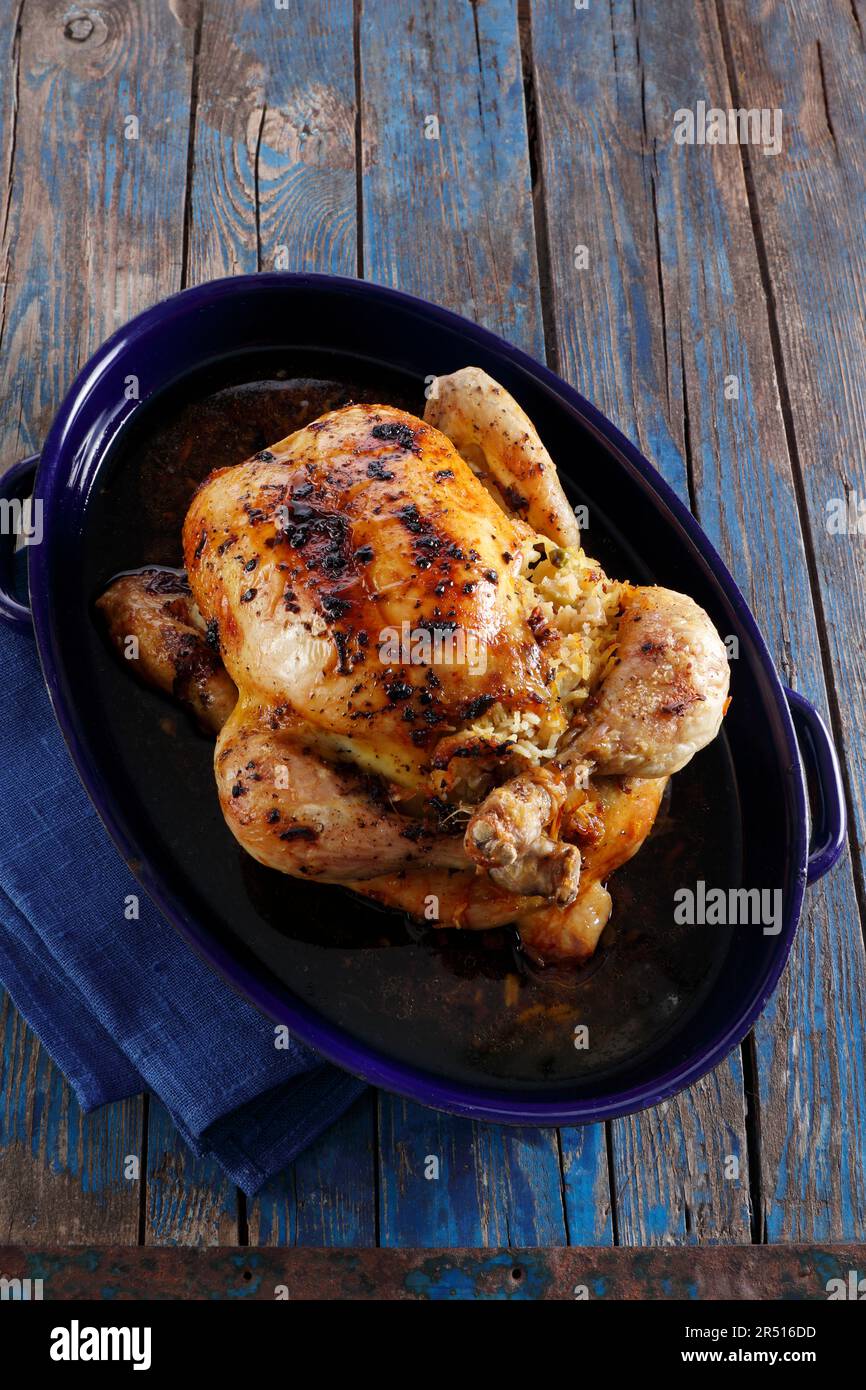 Roast chicken in a roasting tin Stock Photo - Alamy