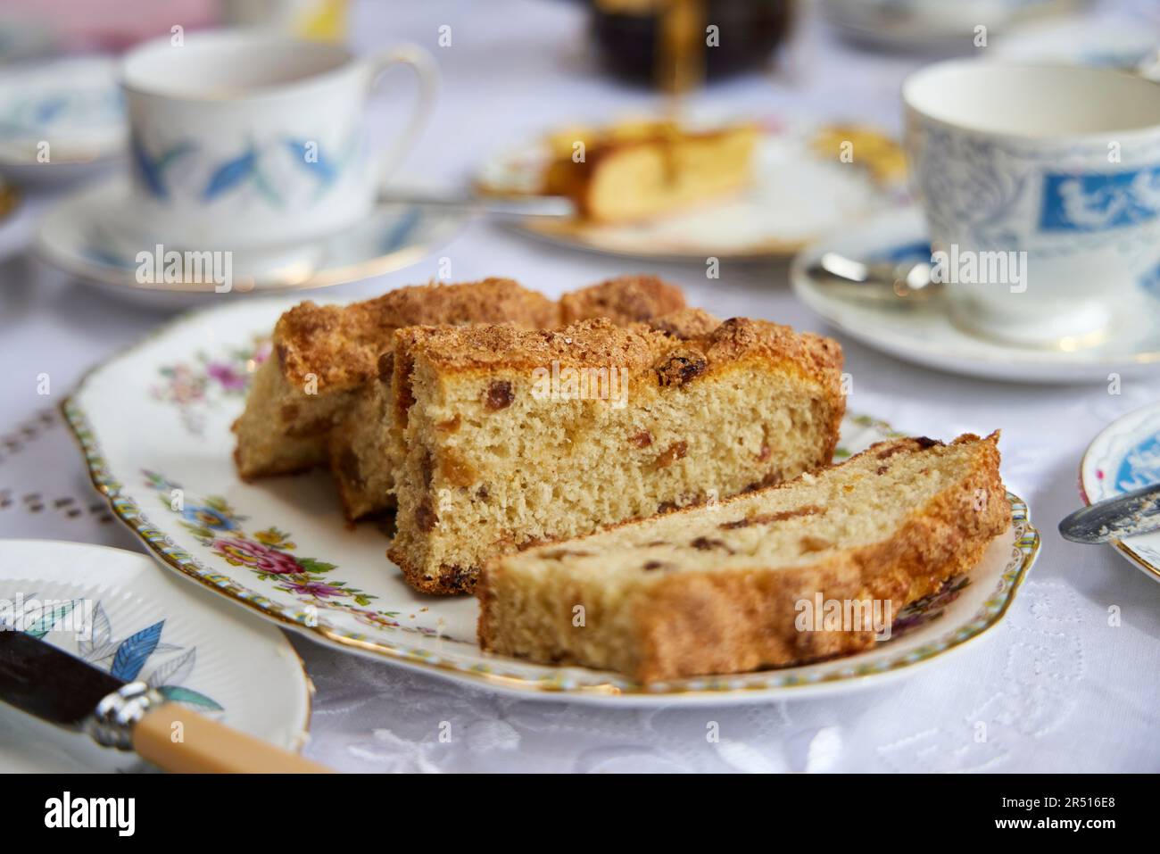 Sweet bread in slices on a covered tea table Stock Photo - Alamy