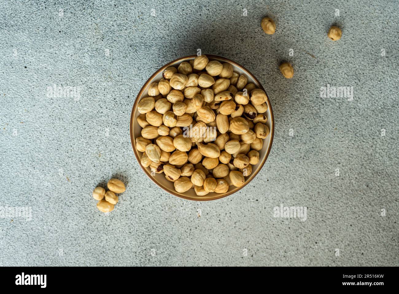 Bowl with hazelnuts on a concrete base Stock Photo - Alamy