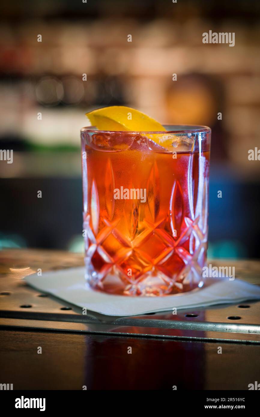 Cocktail in glass on bar counter Stock Photo - Alamy