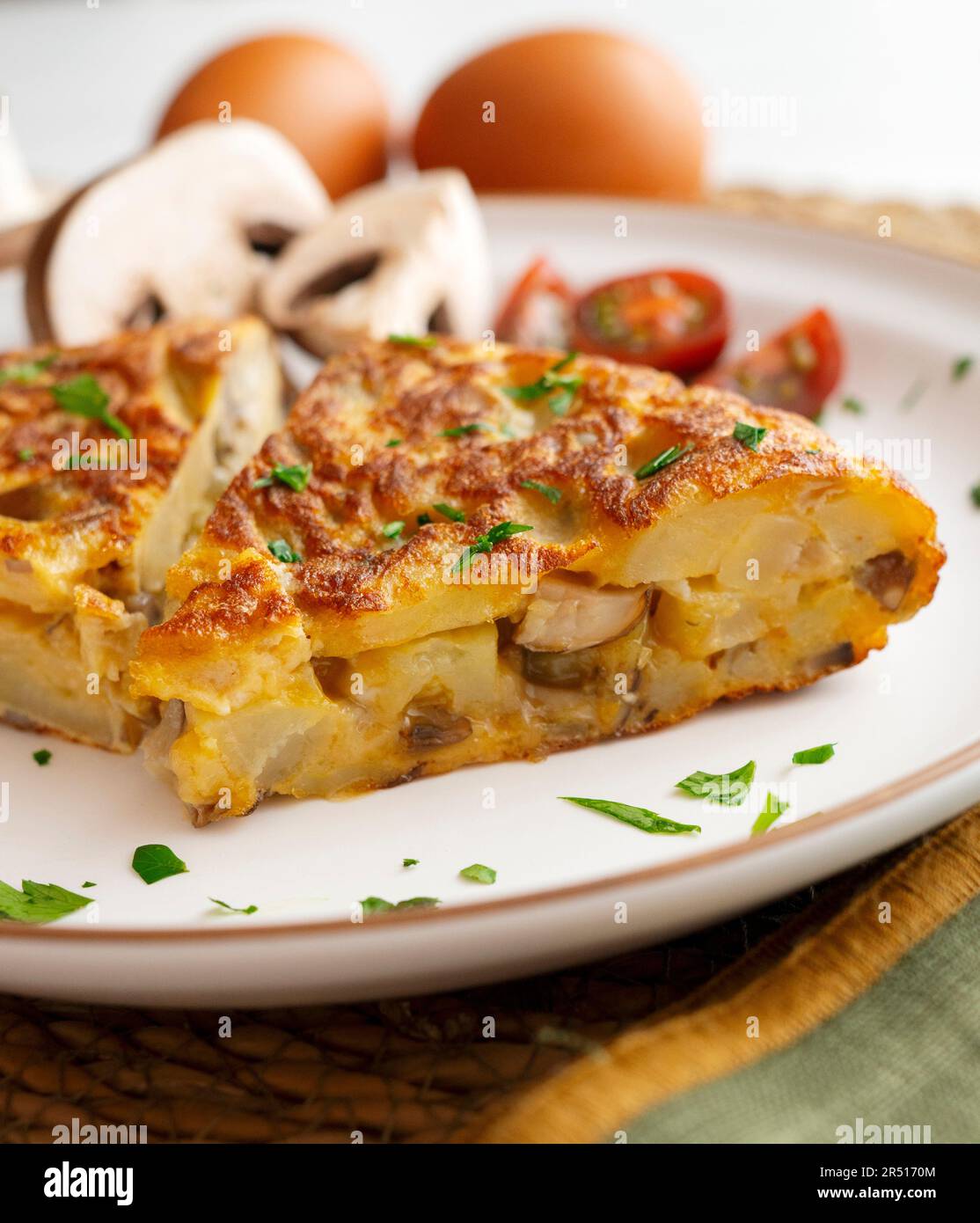 Spanish potato omelette with mushrooms Stock Photo - Alamy