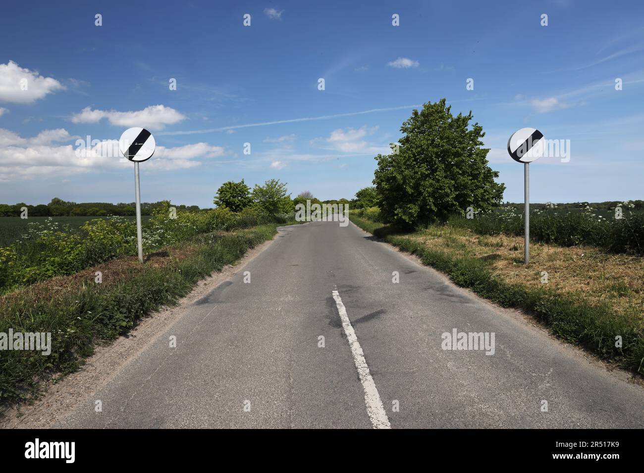 view along straight country road Long Lane, Lessingham, Norfolk, UK May ...