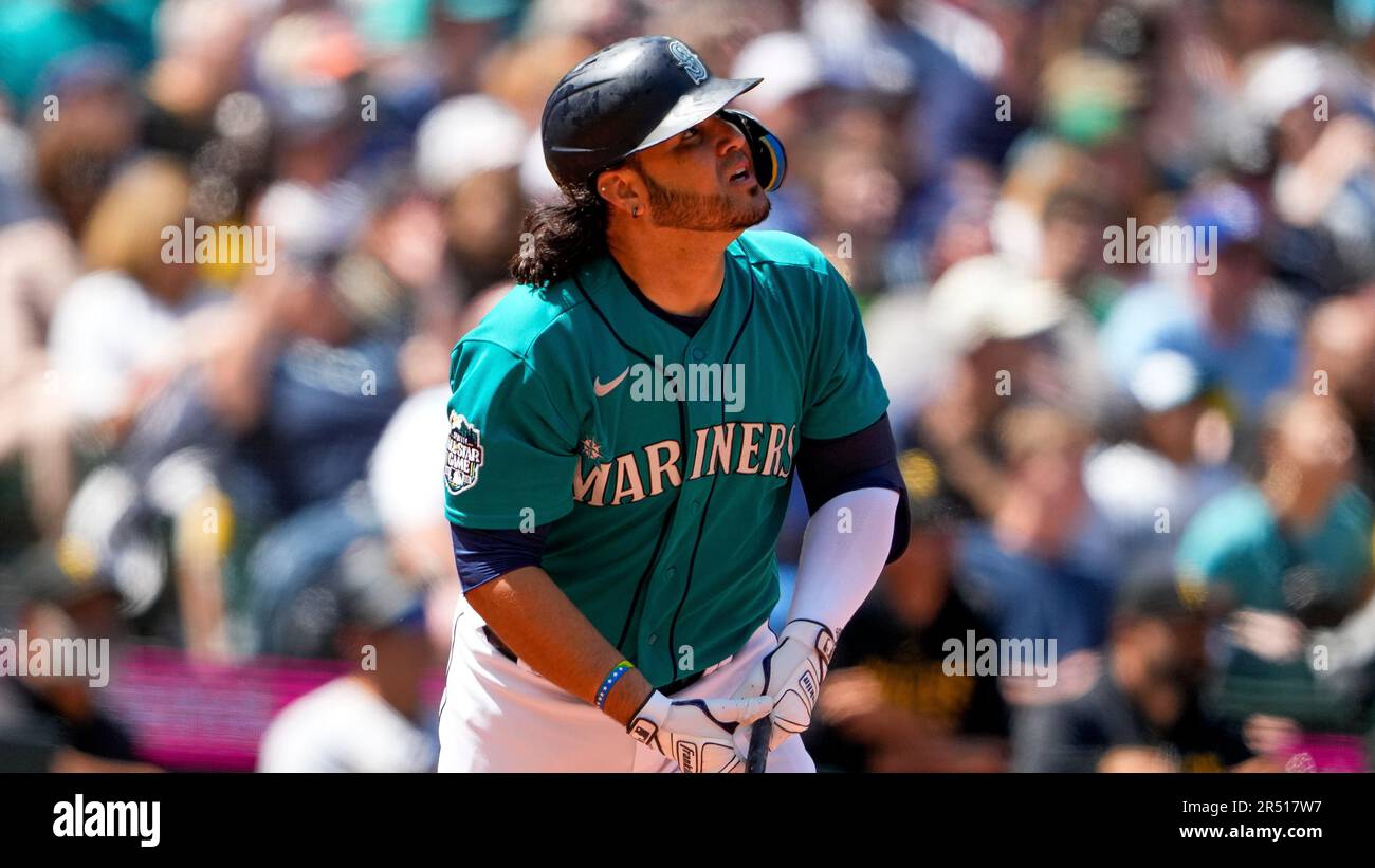 Seattle Mariners' Eugenio Suarez tracks a fly ball hit against the ...