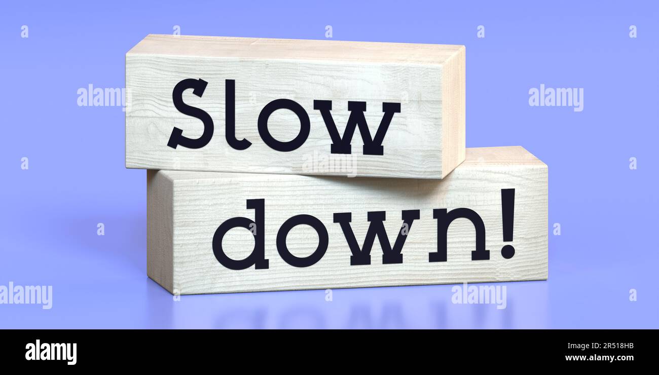 Slow down - words on wooden blocks - 3D illustration Stock Photo - Alamy