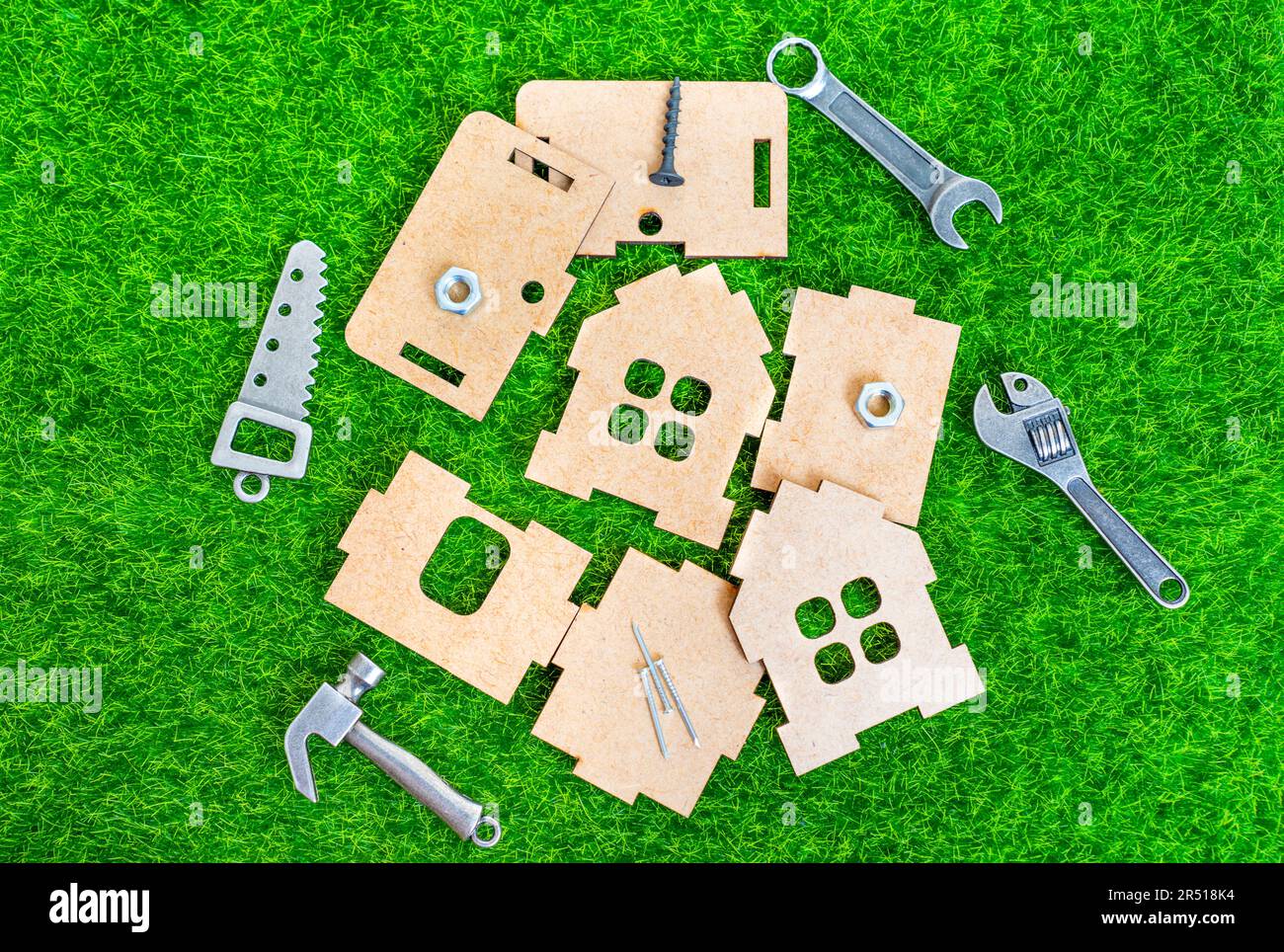 Parts of a disassembled miniature wooden house model, small replicas of ...