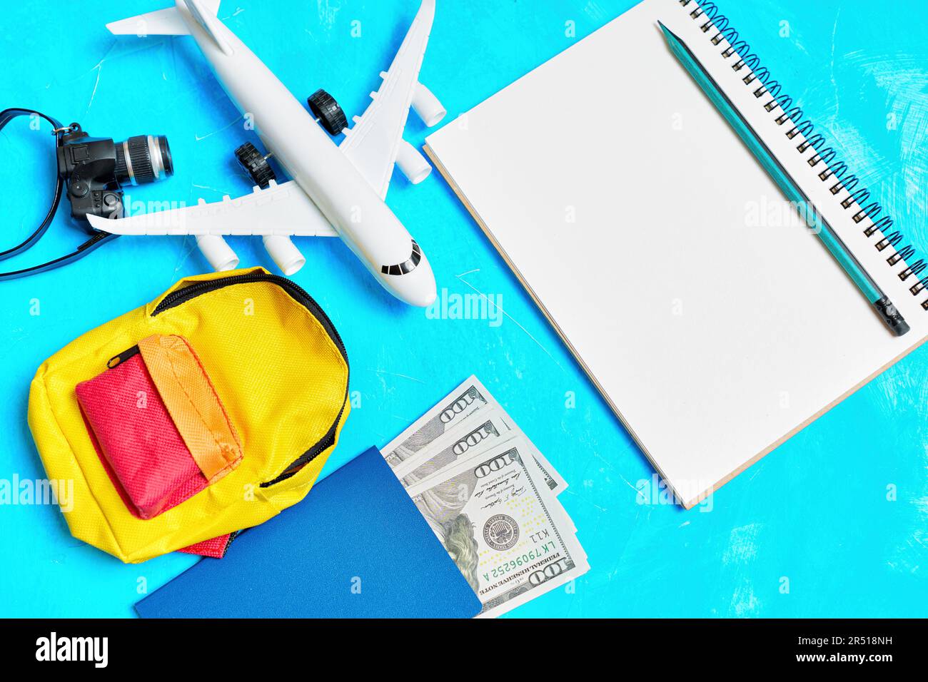 Creative flat-lay related to flight preparation: Toy plane model ...