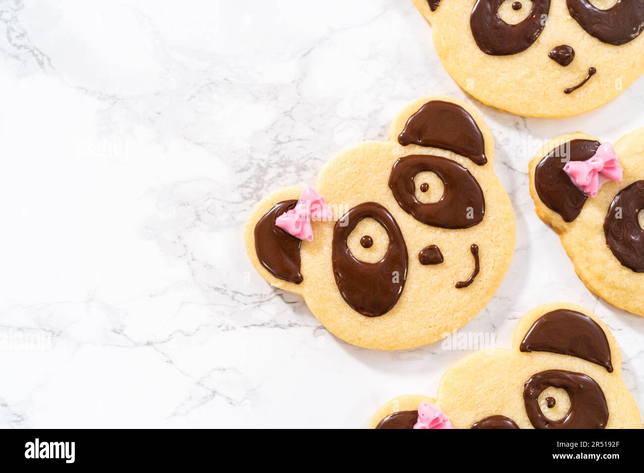 Panda shaped shortbread cookies with chocolate icing Stock Photo - Alamy