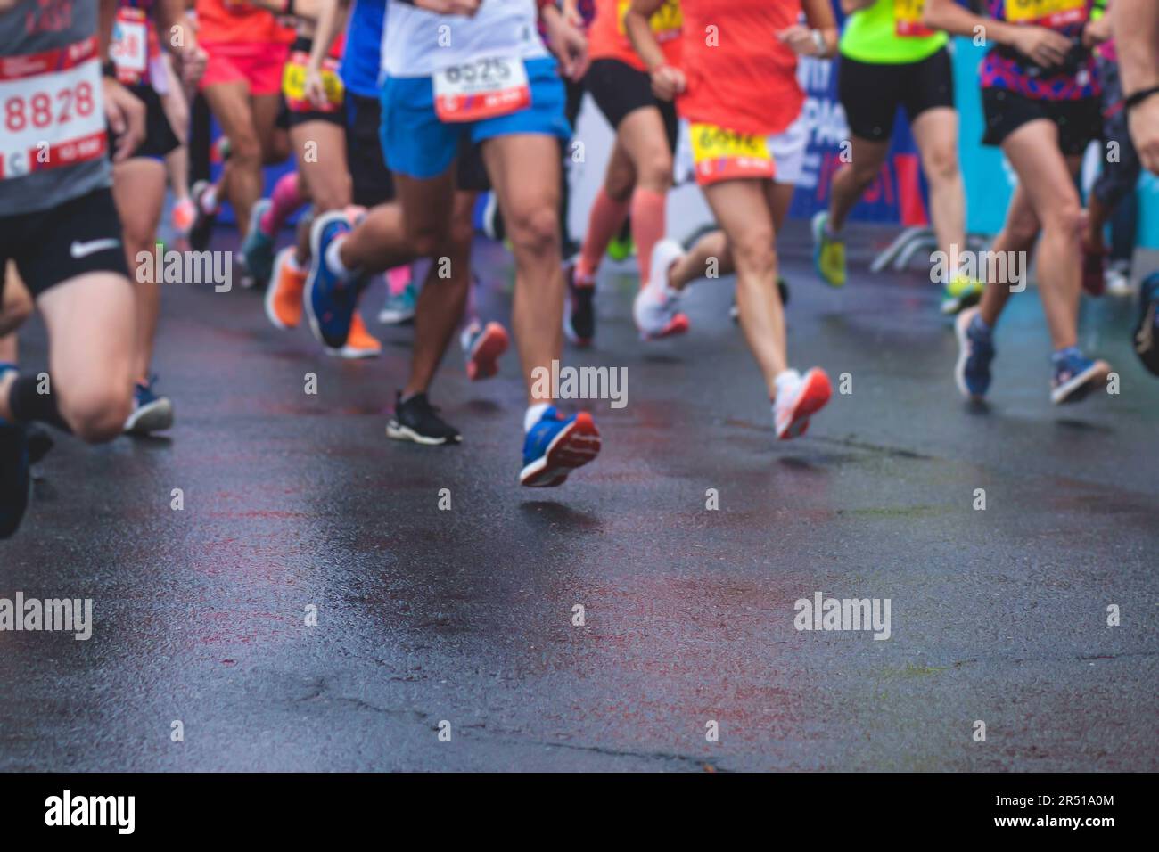 Marathon runners crowd, participants start running the half-marathon in ...
