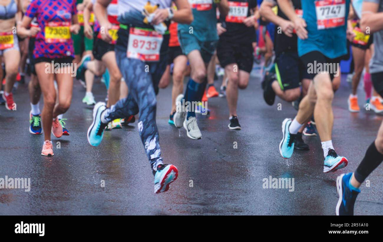 Marathon runners crowd, participants start running the half-marathon in ...