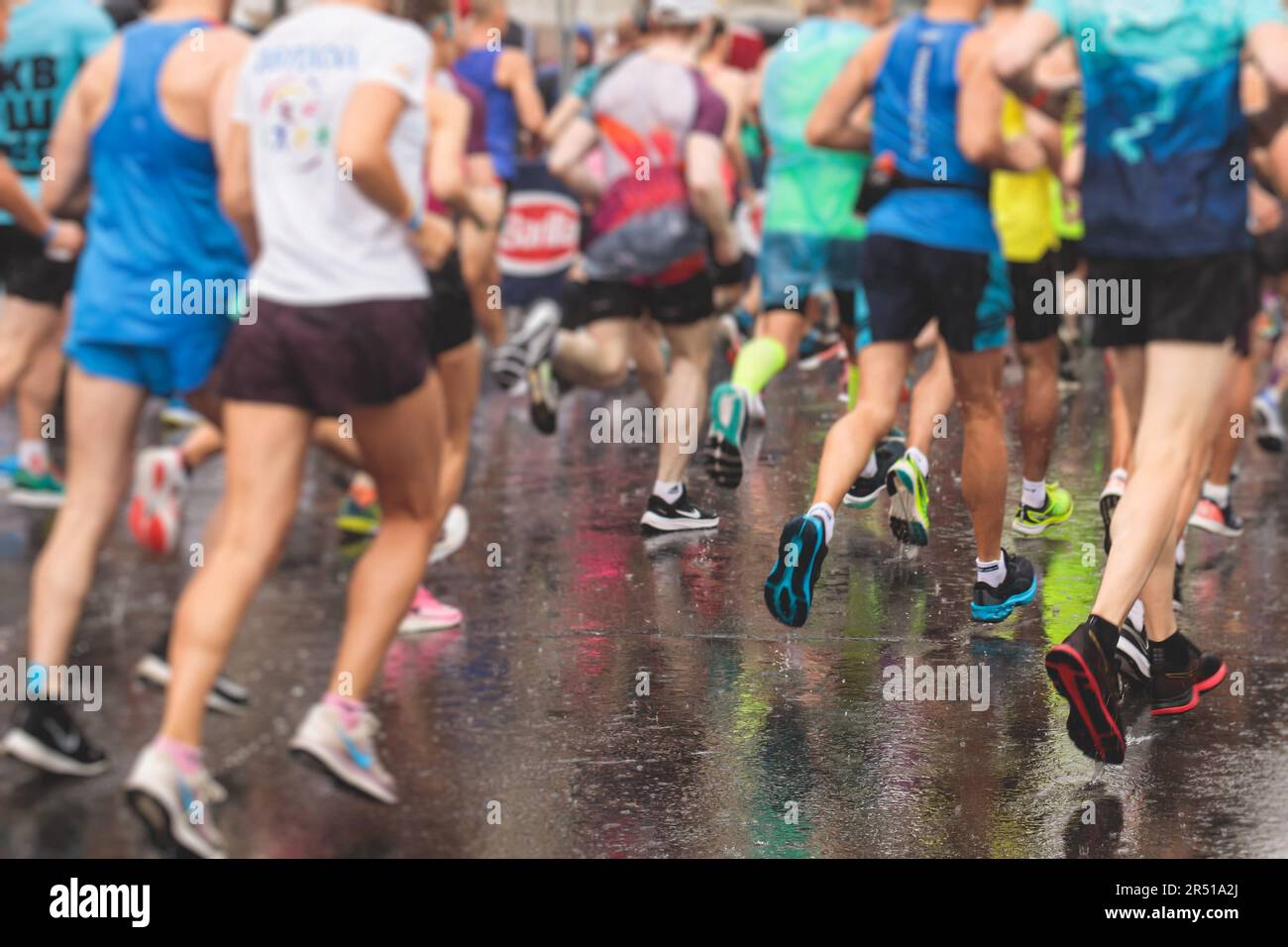 Marathon runners crowd, participants start running the half-marathon in ...