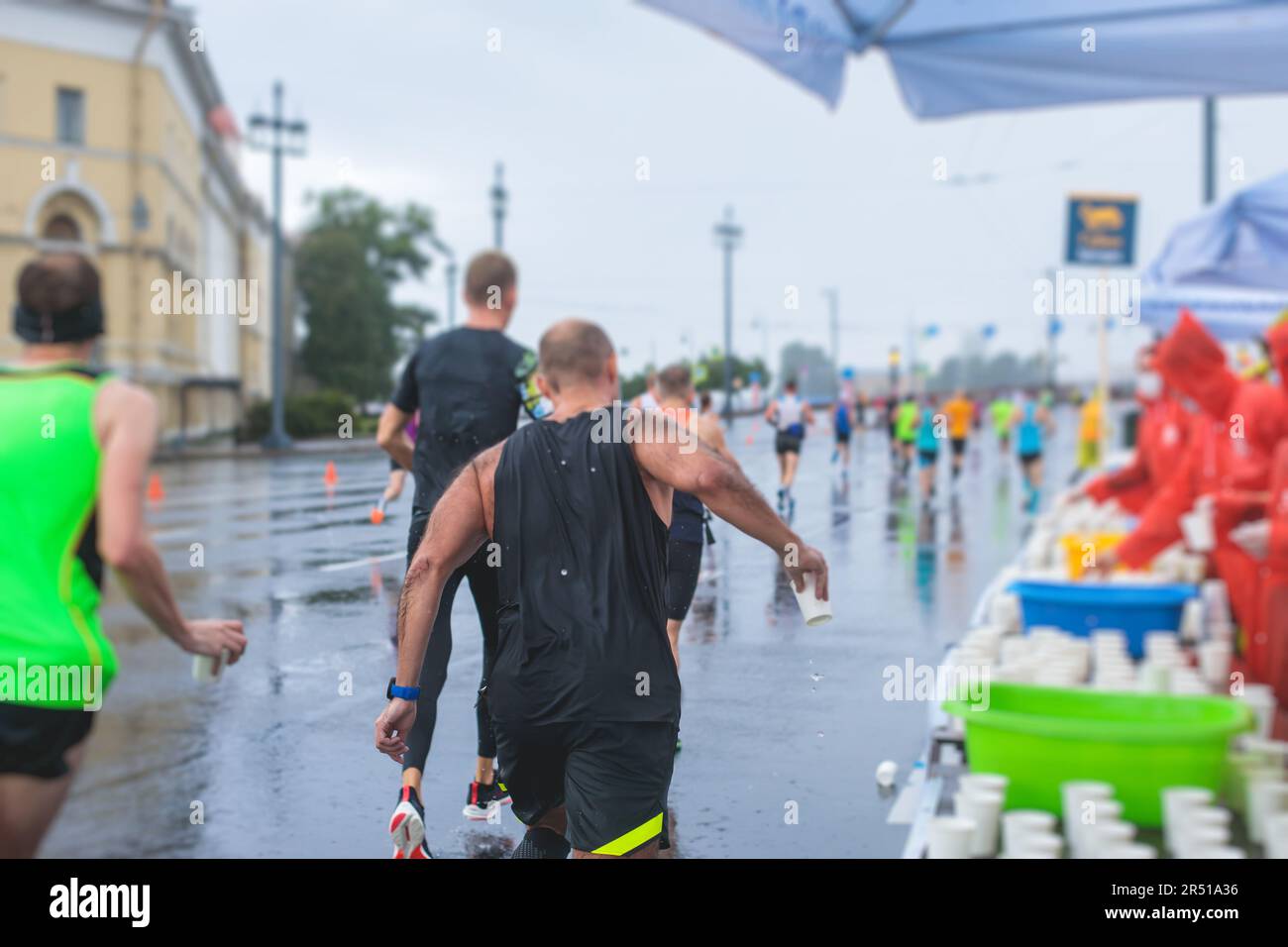 Marathon runners crowd, participants start running the half-marathon in ...