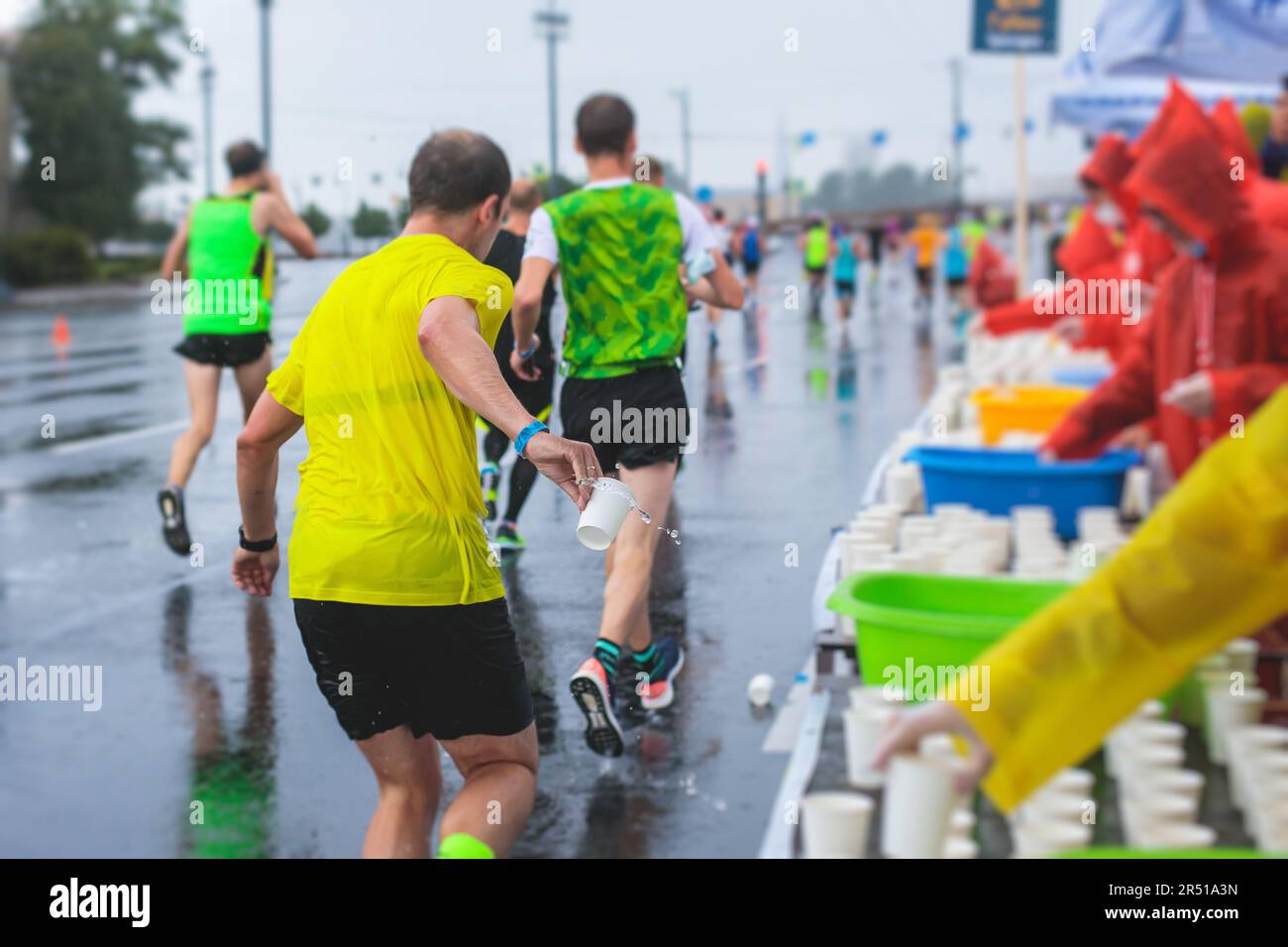 Marathon runners crowd, participants start running the half-marathon in ...