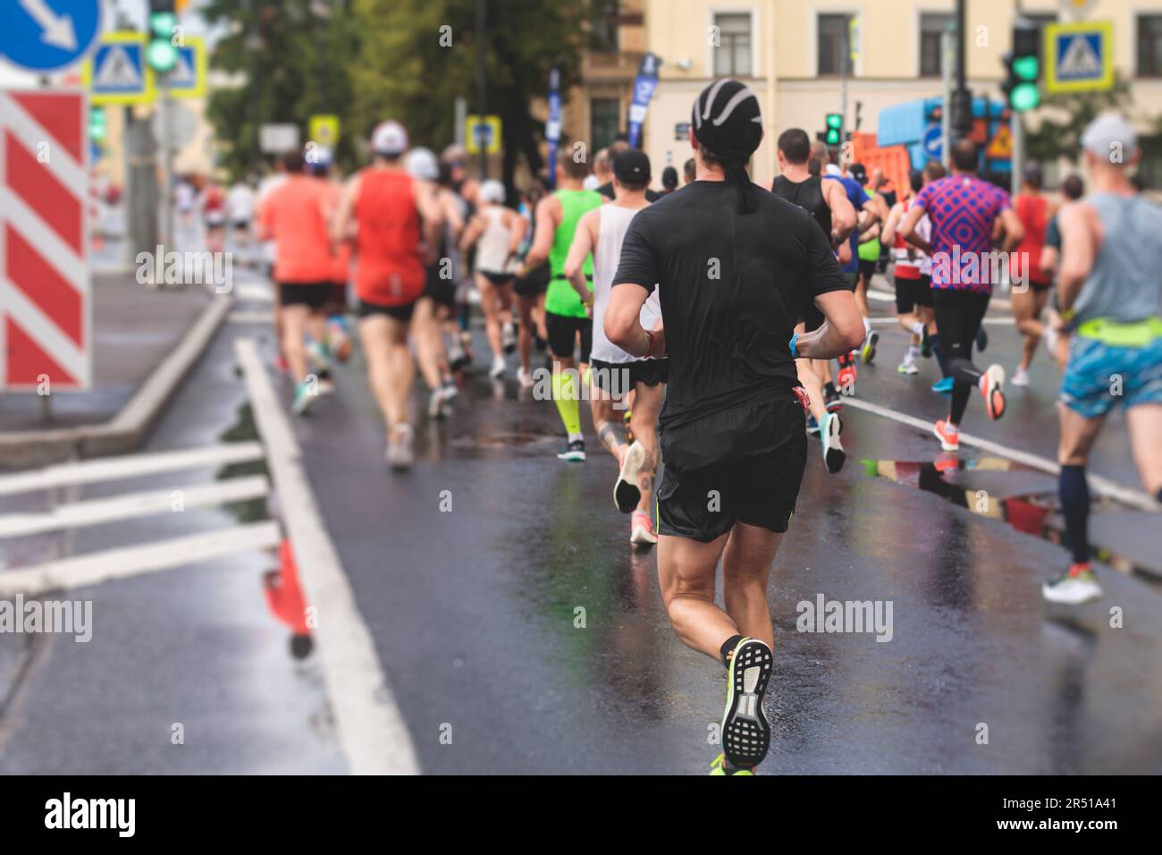 Marathon runners crowd, participants start running the half-marathon in ...