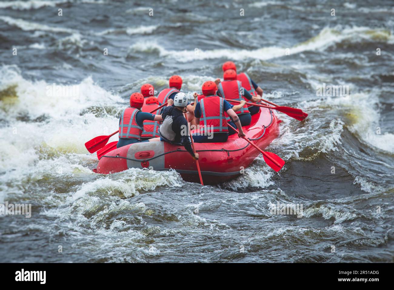 Red raft boat during whitewater rafting extreme water sports on water ...