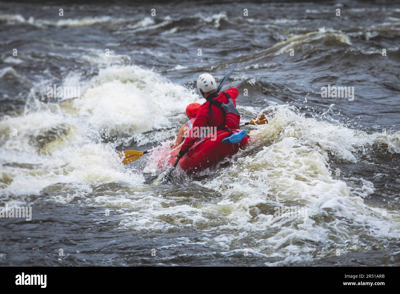 Raft boat during whitewater rafting extreme water sports on water rapids, kayaking and canoeing ...
