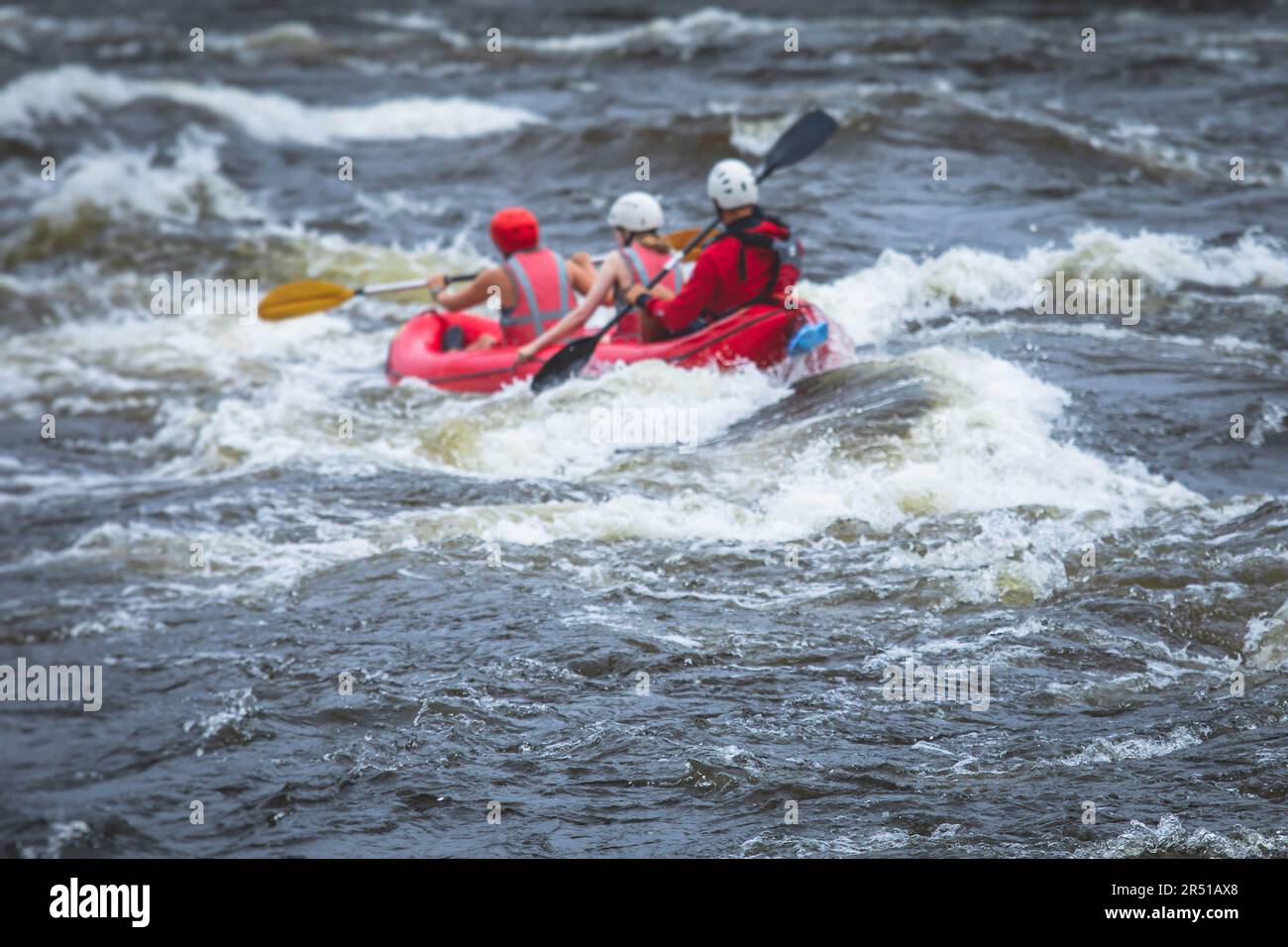 Raft boat during whitewater rafting extreme water sports on water rapids, kayaking and canoeing ...