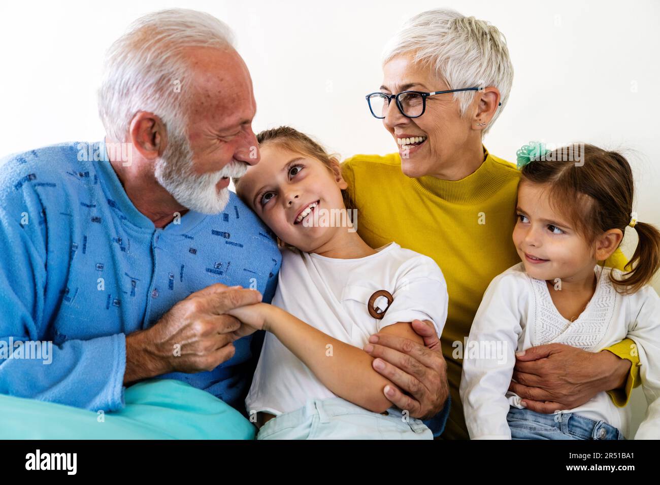 Happy grandchildren visiting grandfather at hospital ward. Support, family and healthcare ...