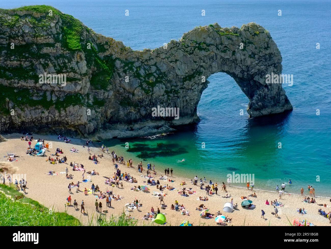 Durdle Door, a natural limestone arch on the Jurassic Coast near ...
